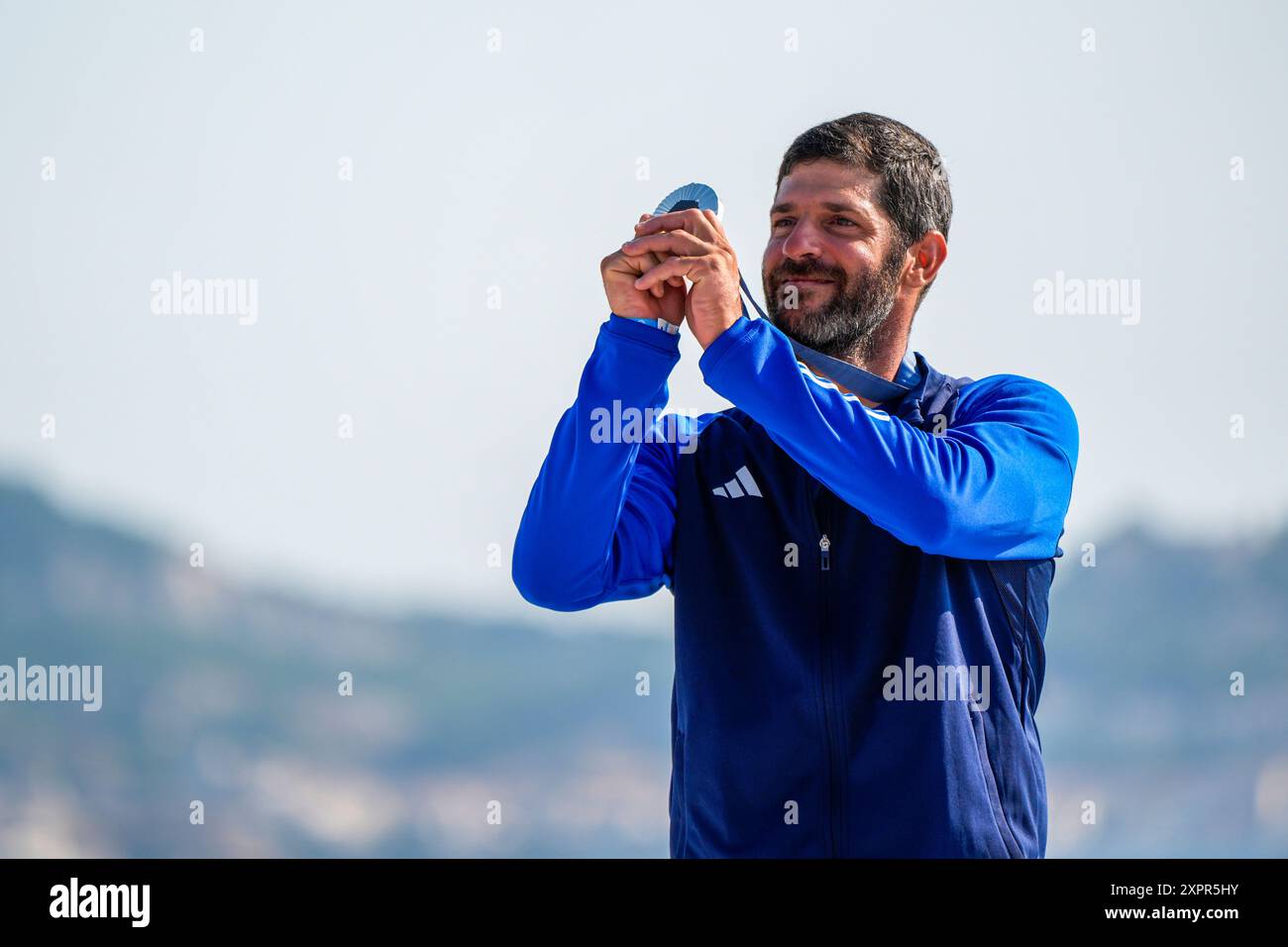 Pavlos Kontides of Cyprus celebrates at the podium after winning his ...