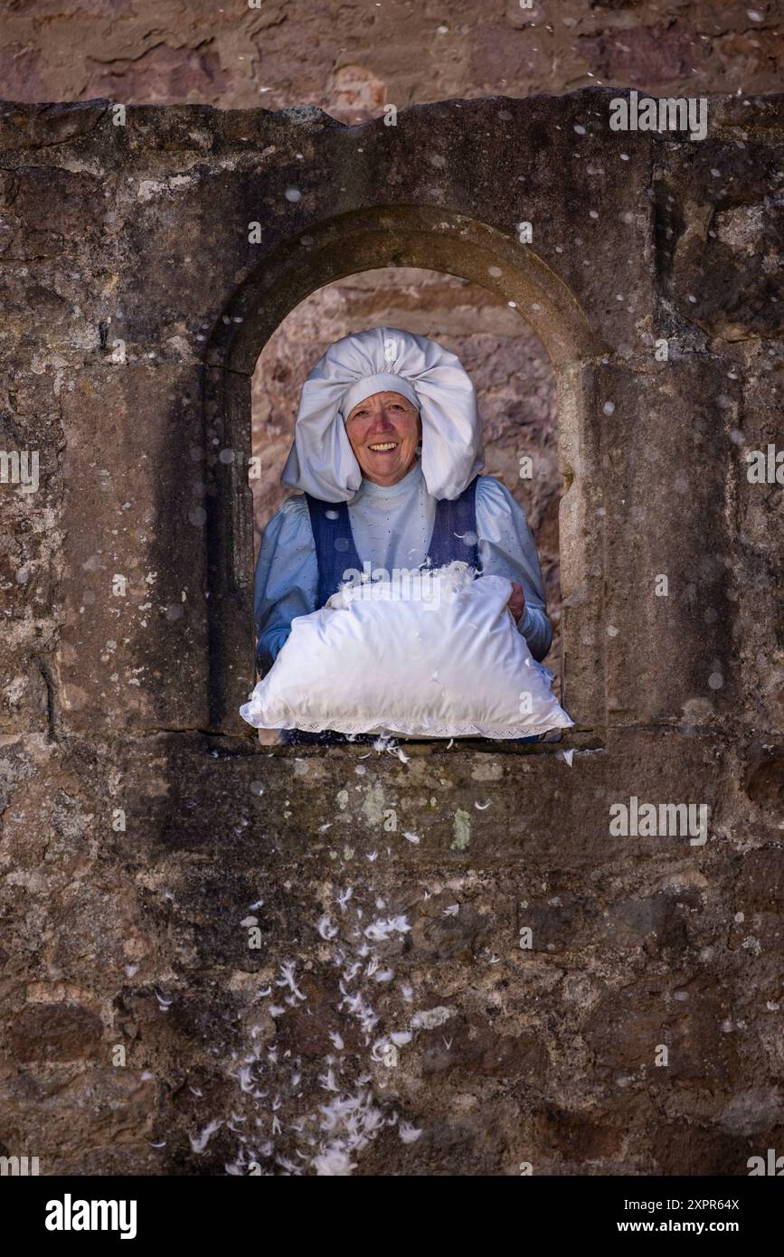 Woman in the costume of the character “Frau Holle” from the fairy tale ...