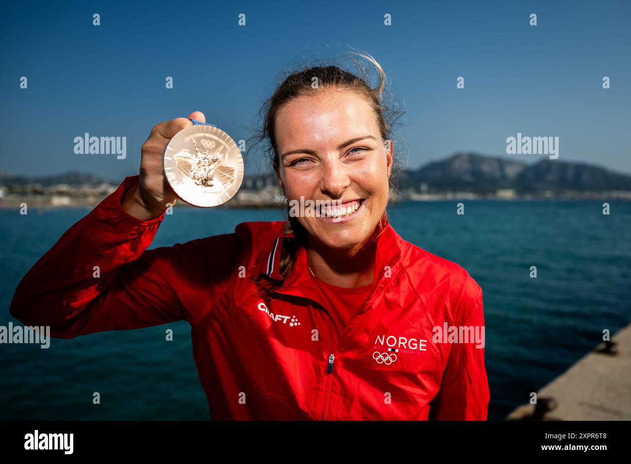 Line Flem Høst of, Norway. , . poses with her bronze medal after the medal ceremony for women's ...