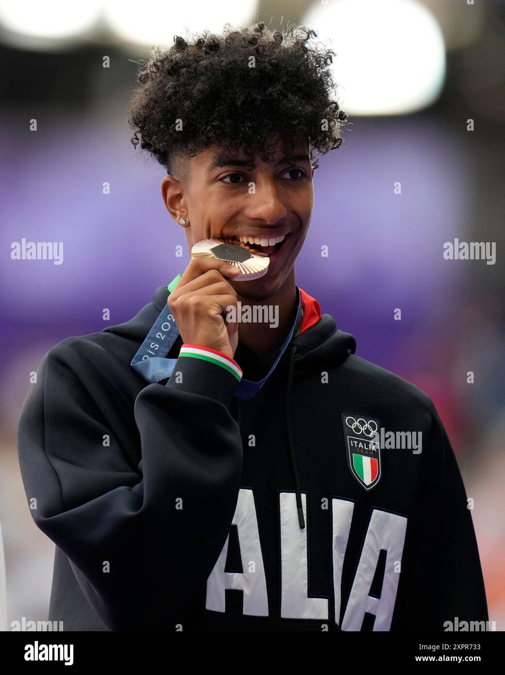 Men's long jump bronze medalist Mattia Furlani, of Italy, poses with ...