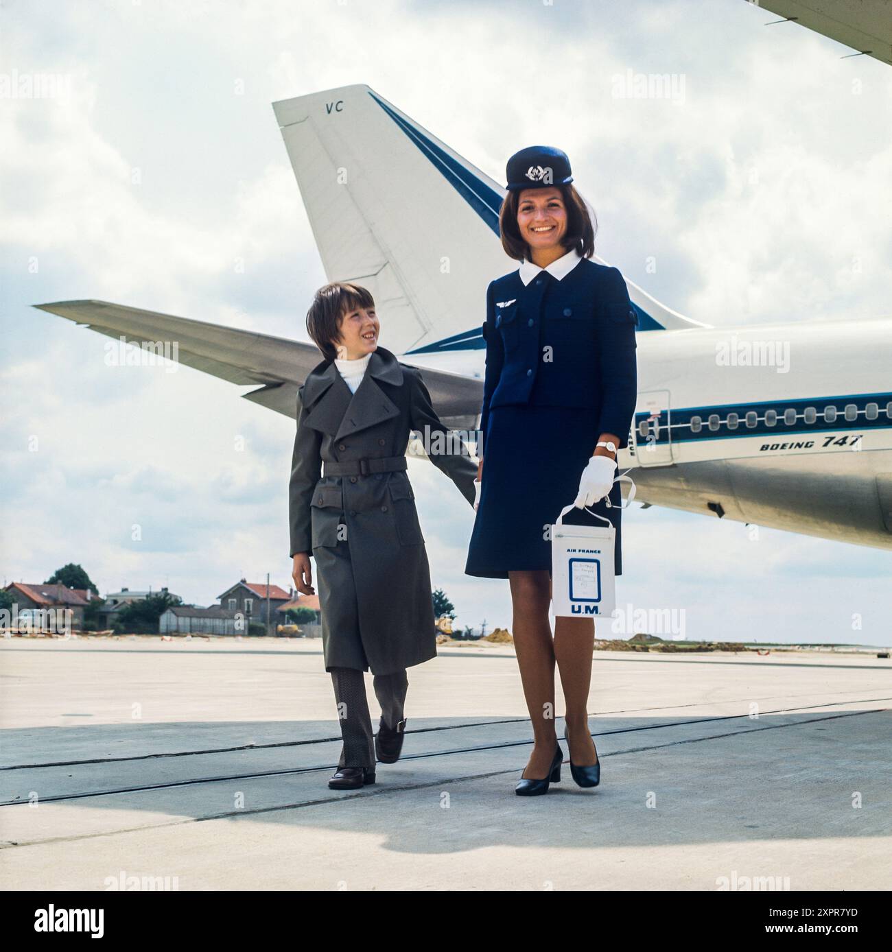 1980s Air France hostess and young boy UM passenger (Unaccompanied ...