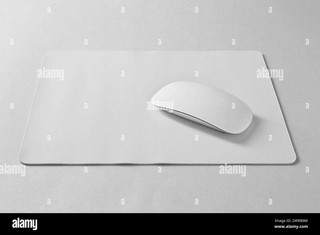Wireless mouse and mousepad on white background Stock Photo - Alamy