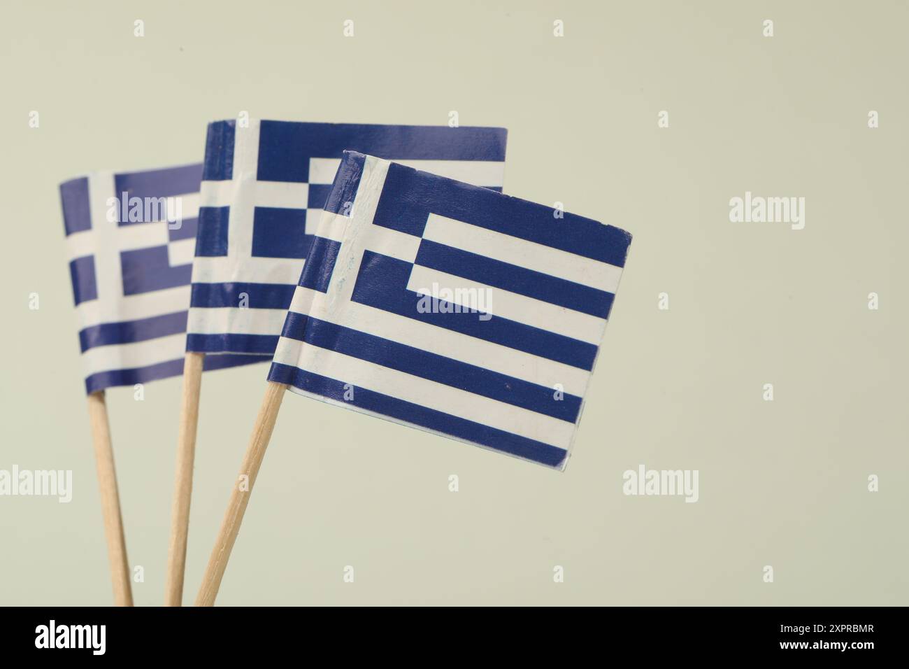 Small paper flags of Greece on light background, space for text Stock ...