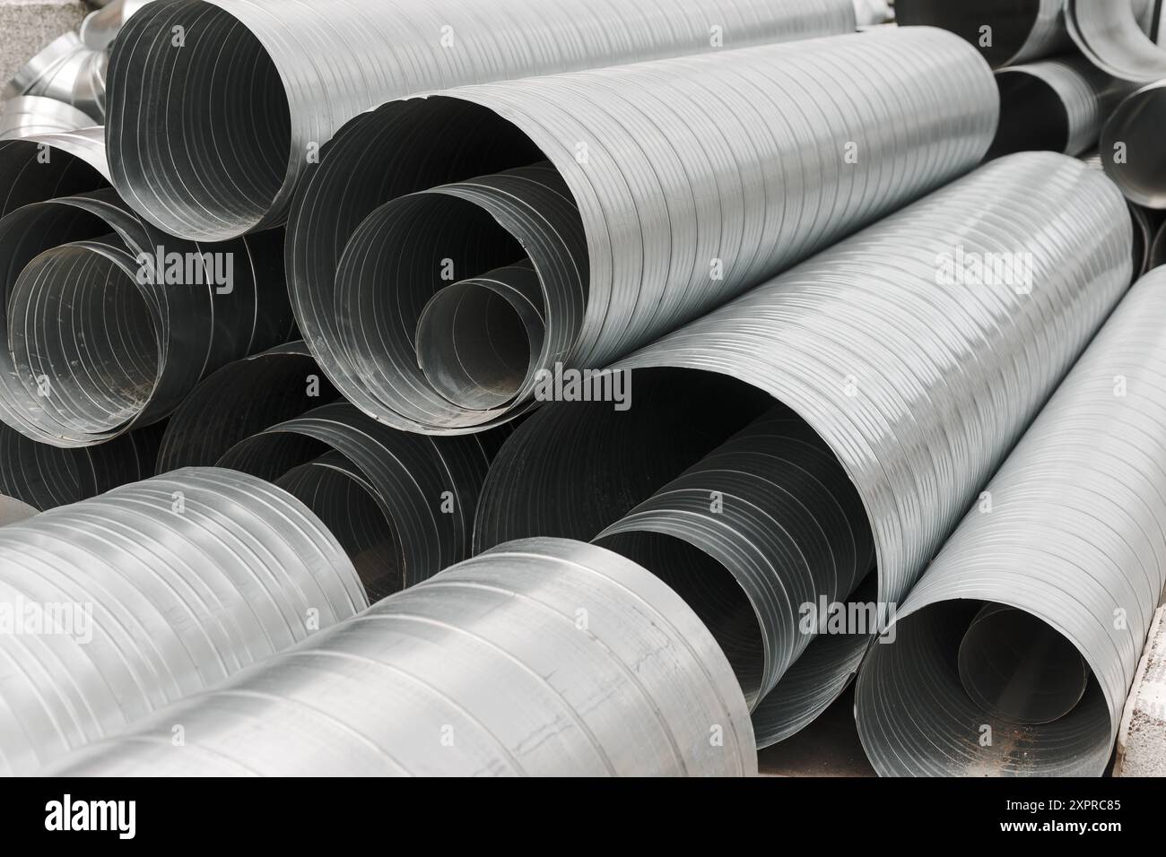 Metal profile pipes of different sizes are located in the warehouse of ...