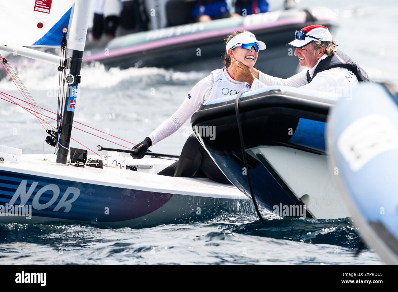 Line Flem Høst of, Norway. , . celebrate with a coach from Norway after winning bronze in women ...