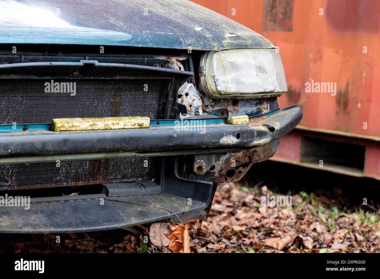 Wreck of old car with no bumper, wheels and other parts missing Stock ...