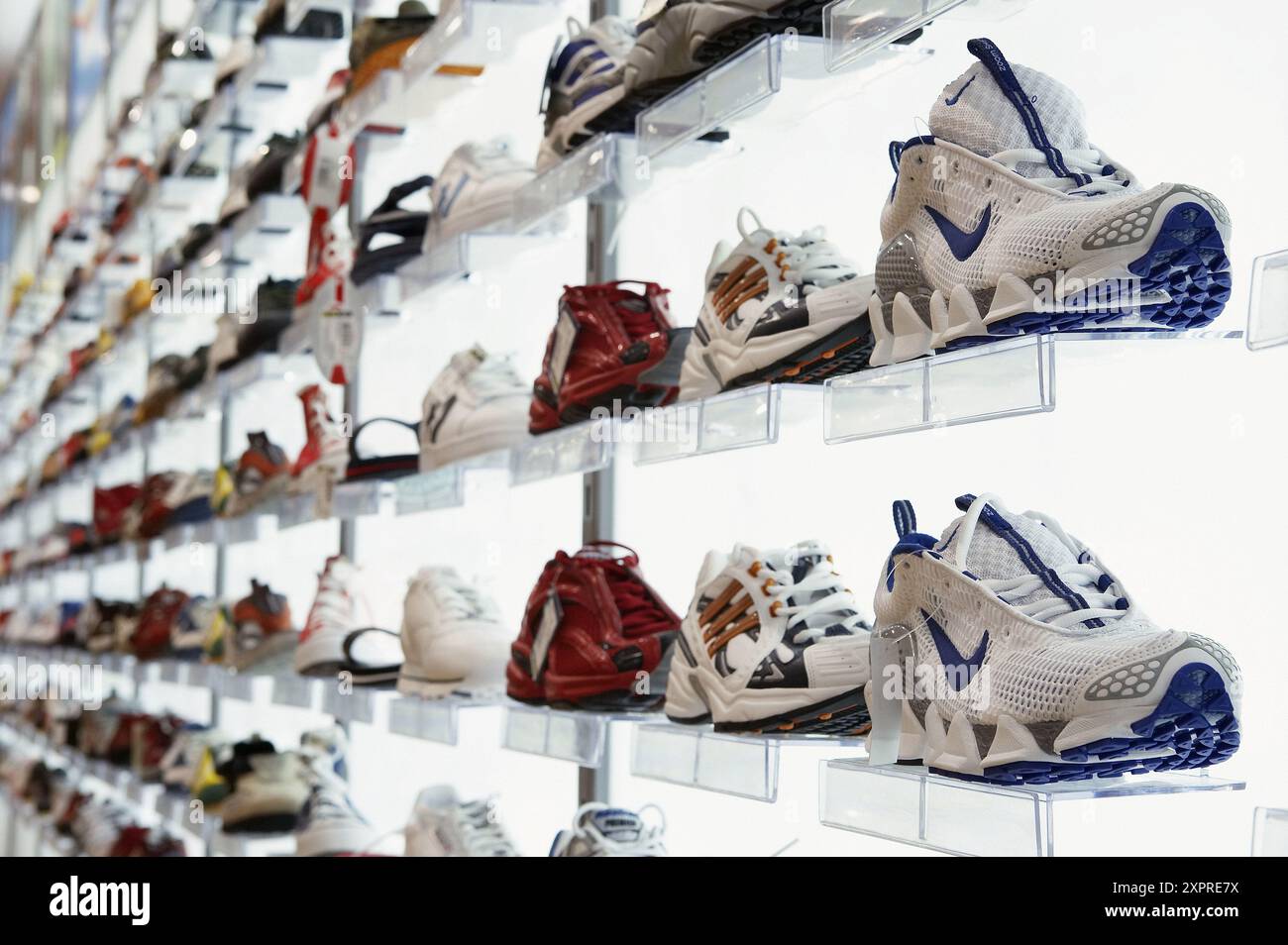 Sports shoes in shoe shop, shopping mall Stock Photo - Alamy