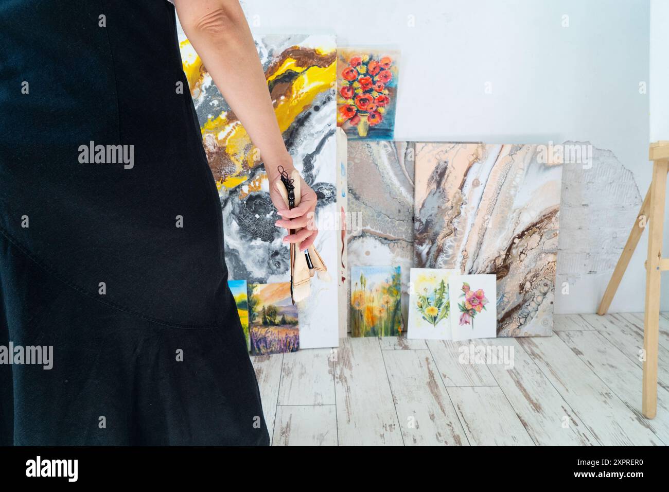 A Creative Artist is diligently at work in a bright and vibrant studio ...