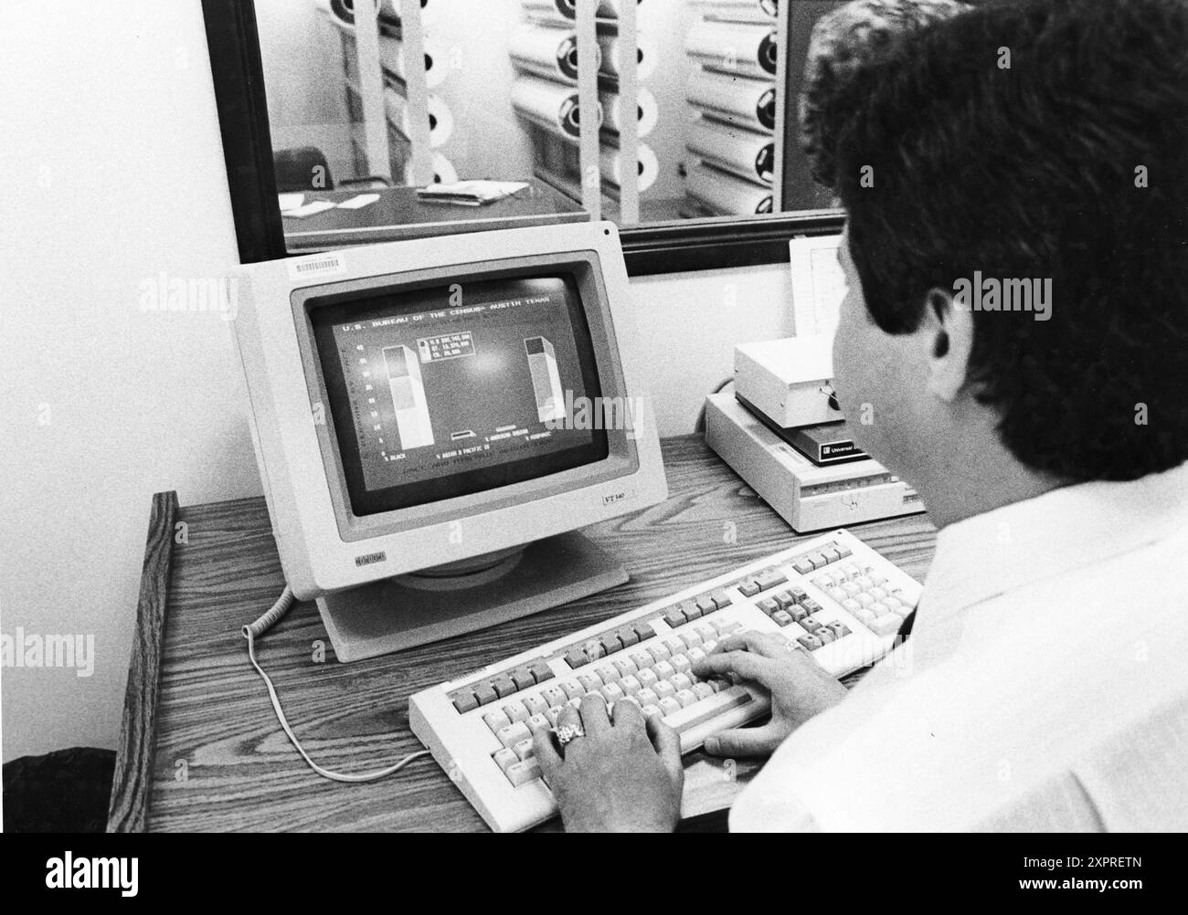 Austin, Texas USA,1990: Data entry clerk types information into ...