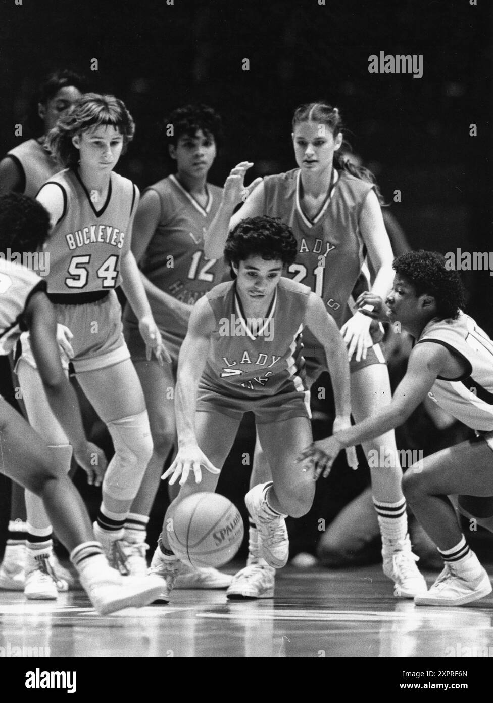 Austin Texas USA, 1993: Female basketball player dribbles through a ...