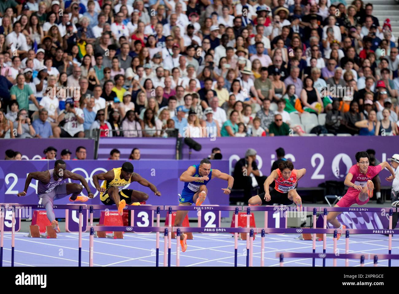 Athletes compete in the men's 110-meters hurdles semifinal at the 2024 ...