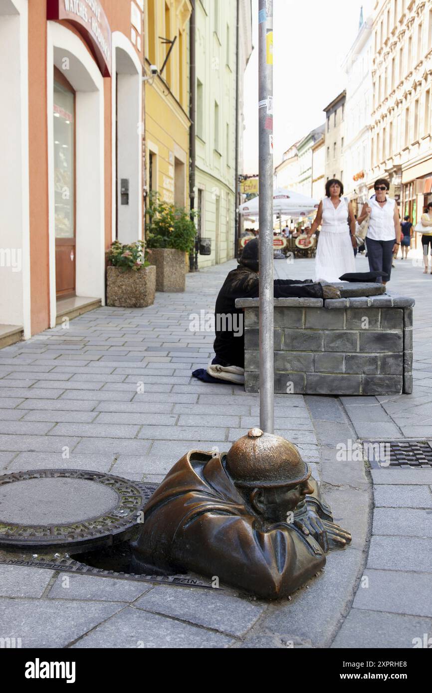 Rubberneck statue sticking out of a manhole, Bratislava, Slovakia Stock ...