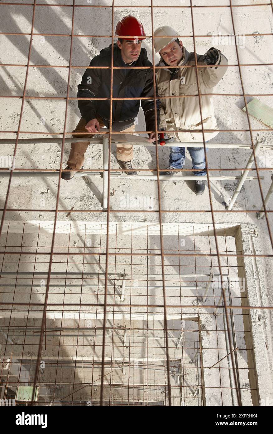 Architect and construction worker, personal protective equipment ...
