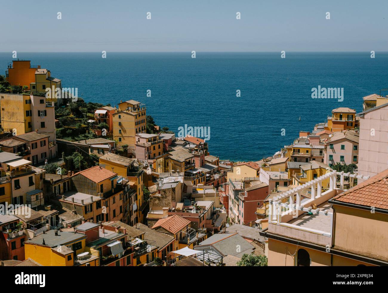 A breathtaking view of the vibrant coastal village of Riomaggiore, one of the five picturesque ...