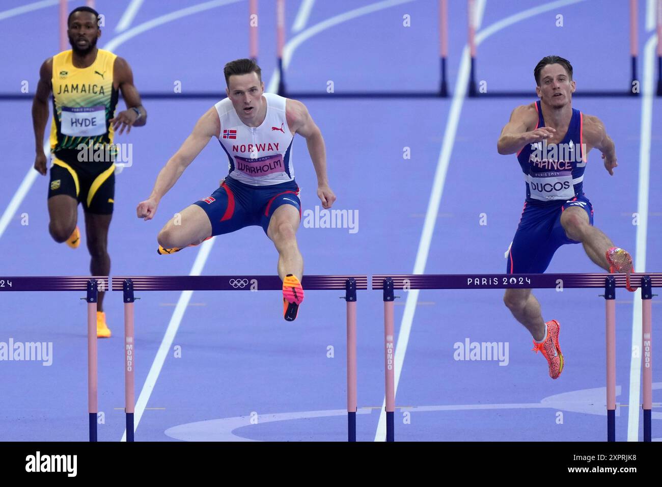 Karsten Warholm, of Norway, and Clement Ducos, right, of France ...