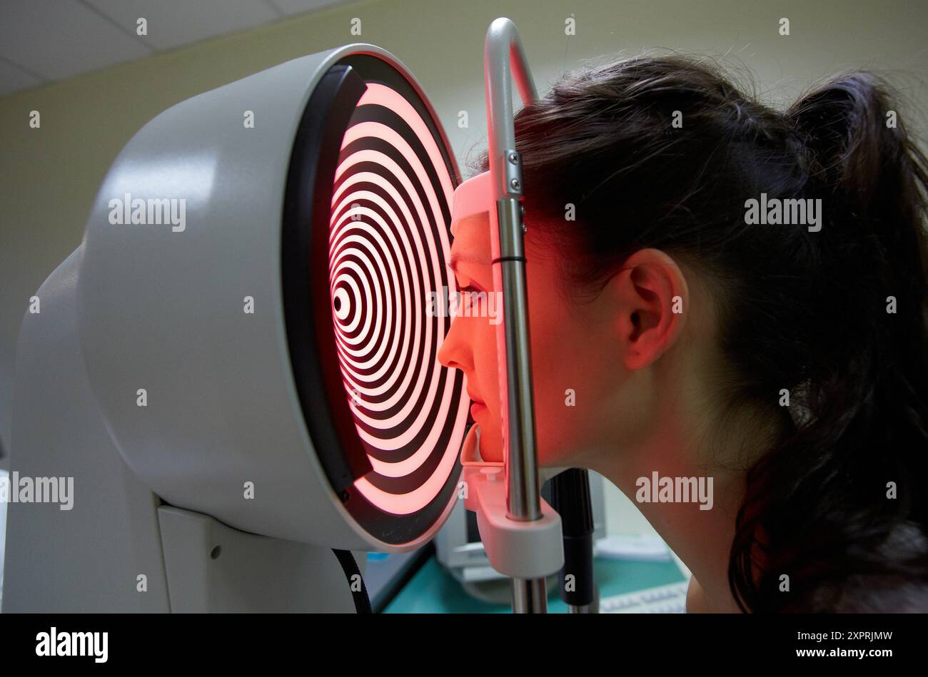 Eye examination Patient having a corneal topography measurement made of ...