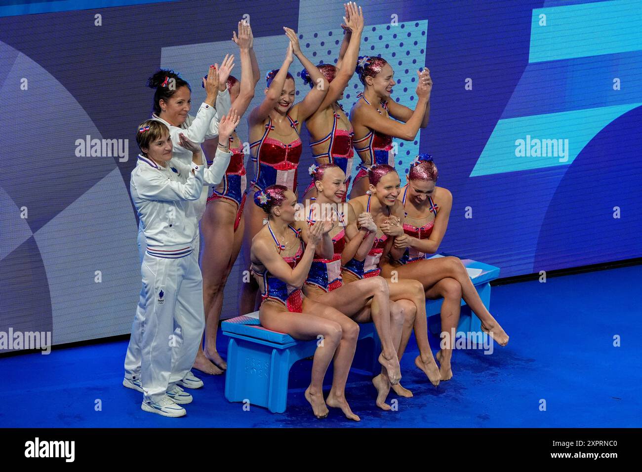 Team France react after competing in the team acrobatic routine of ...