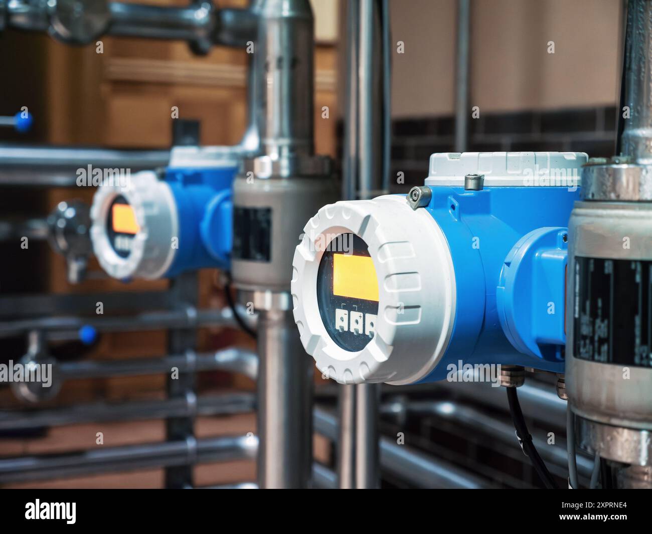 Digital flow meters in brewery, modern technology for monitoring and ...