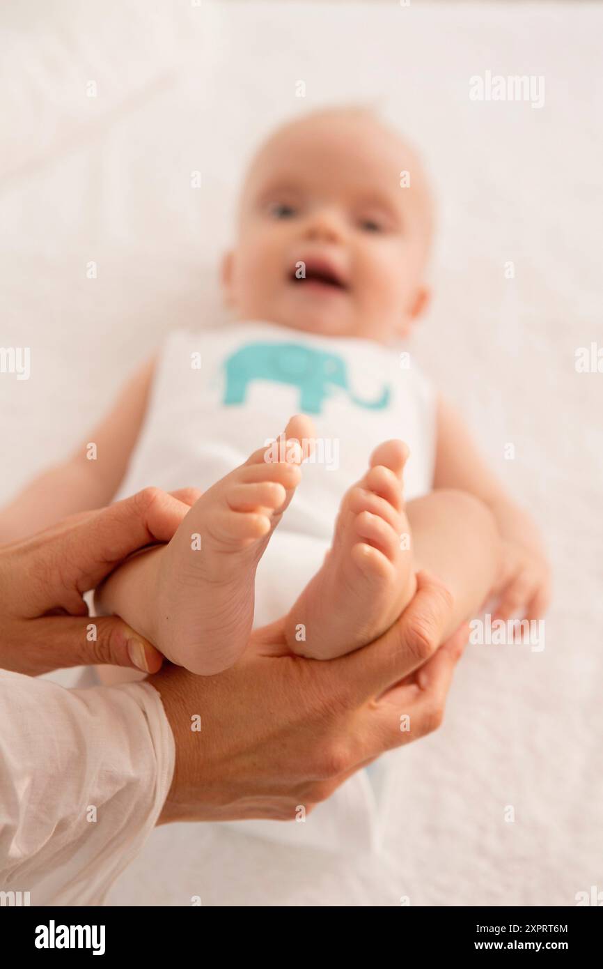Six month old babies feet Stock Photo - Alamy