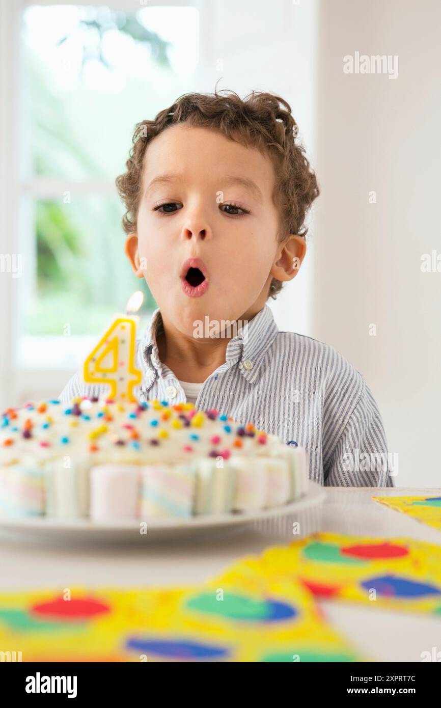 Four year old boy celebrating his birthday Stock Photo - Alamy