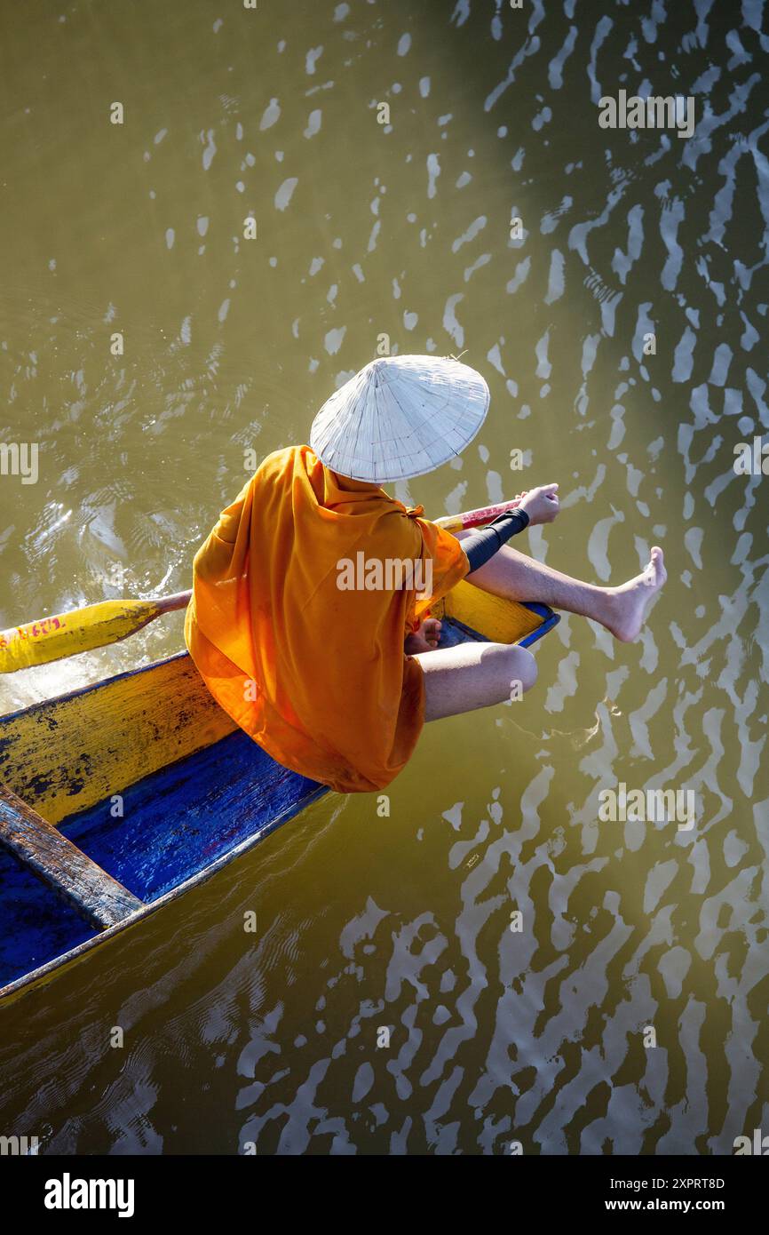 Buddhist monks on a row boat on the Mekong River in Paske, Laos Stock ...