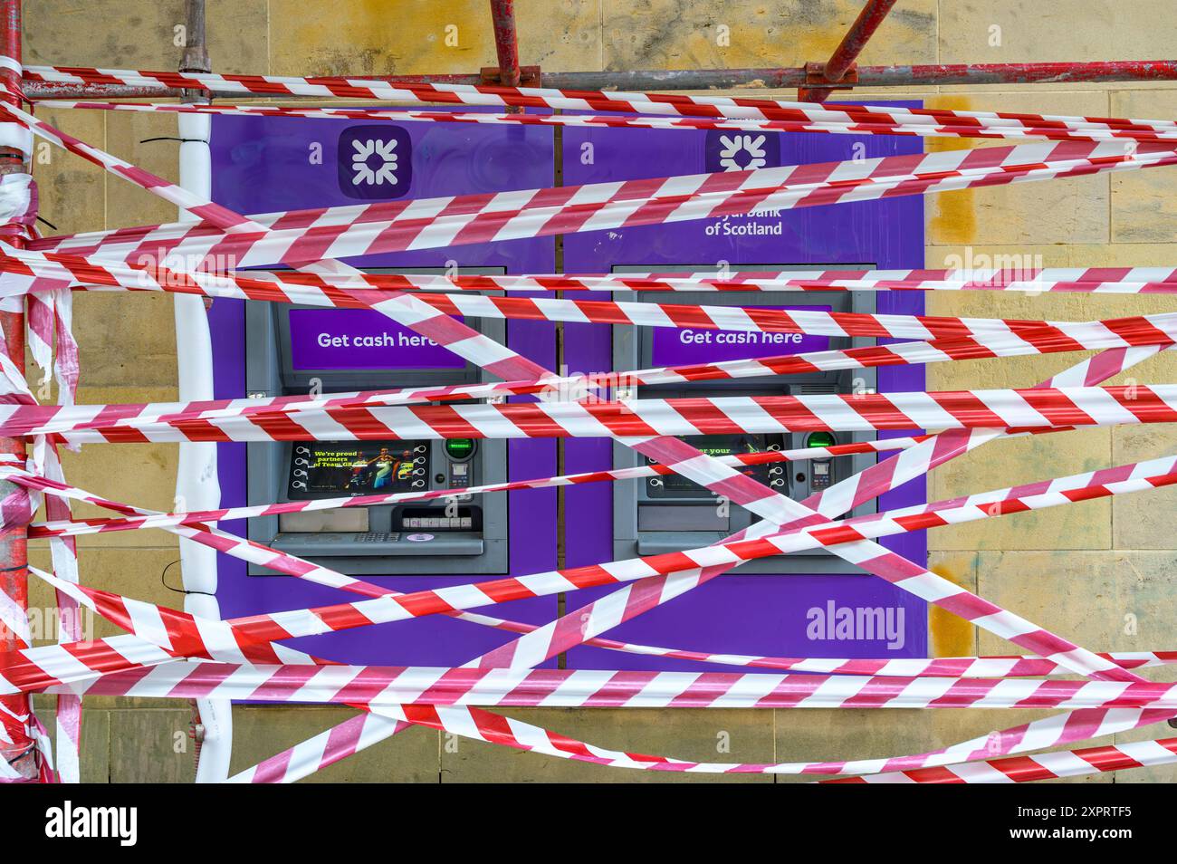 Cash machine obstructed by red tape Stock Photo - Alamy