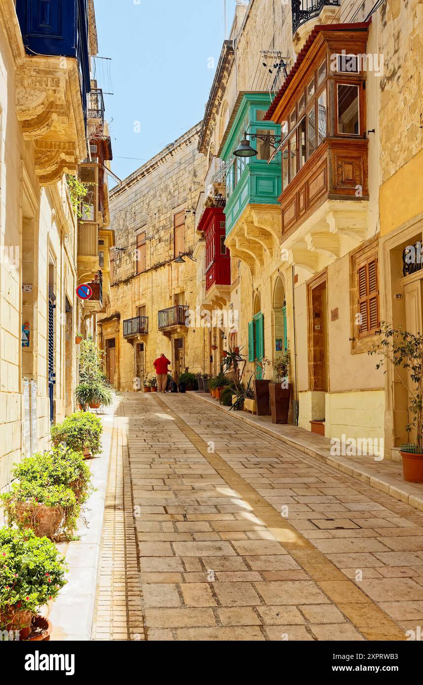 street scene; old limestone buildings; golden yellow color, cityscape ...