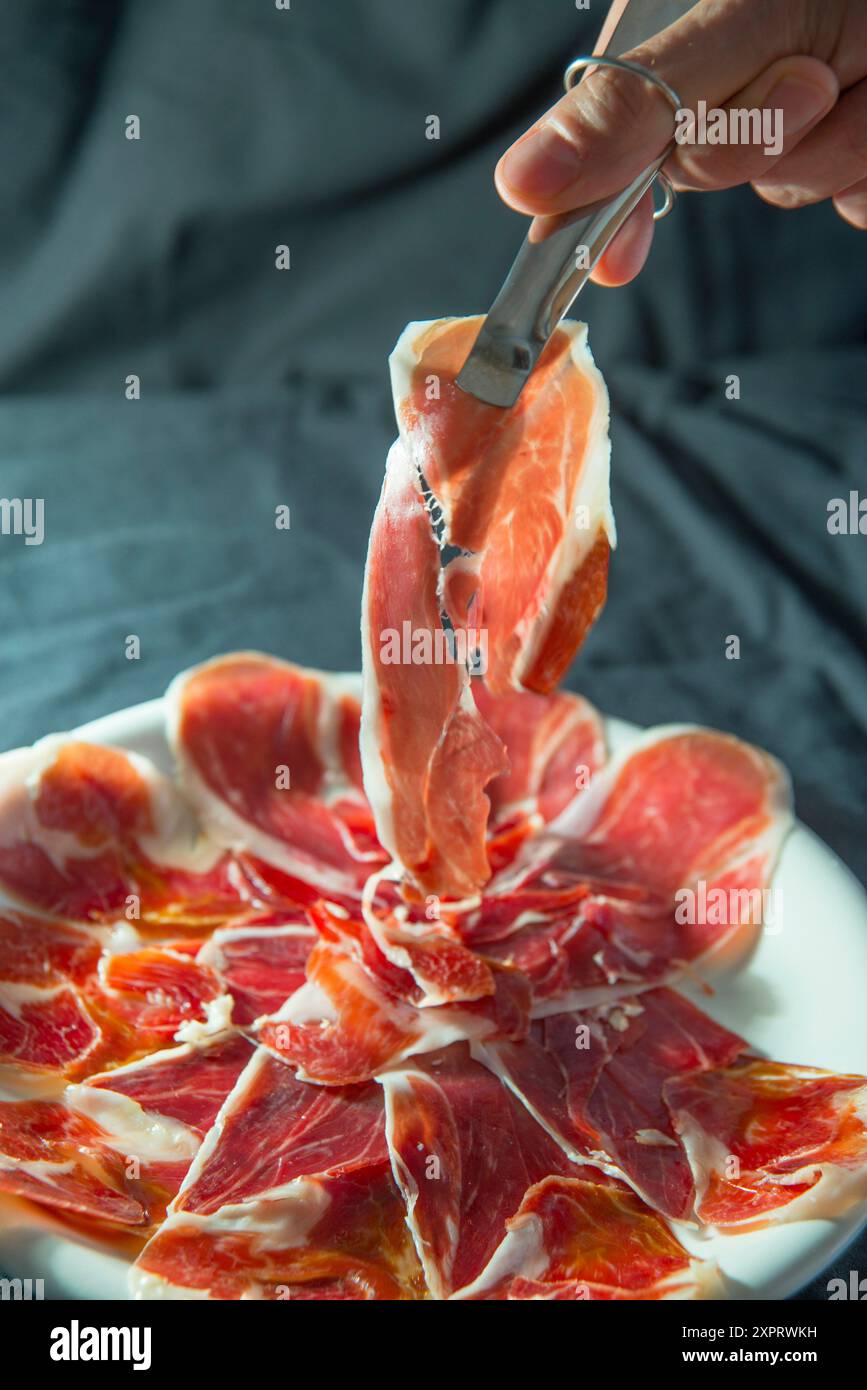 Man holding a piece of meat hi-res stock photography and images - Alamy