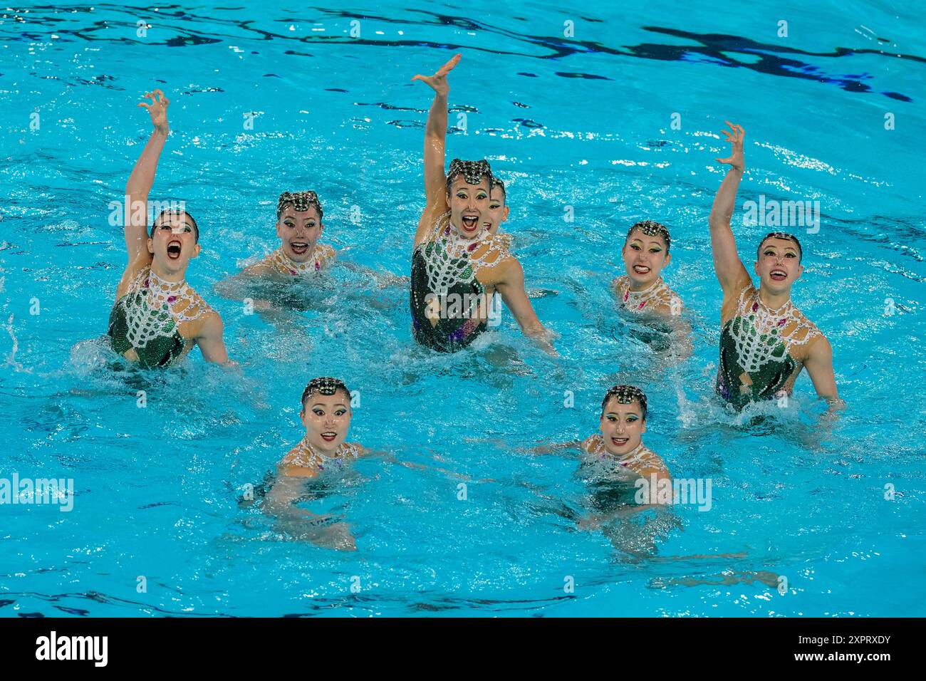 Team Japan competes in the team acrobatic routine of artistic swimming ...