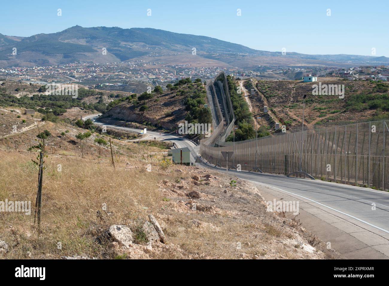 A high-security border fence system with six-meter-high wire fences in ...