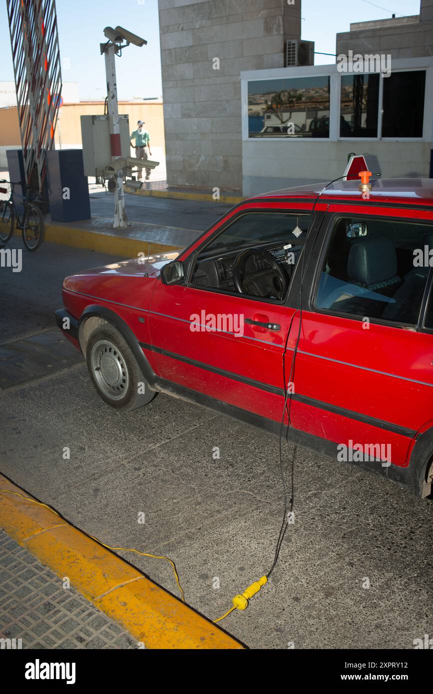 A red car undergoing inspection at the European Union's external border ...