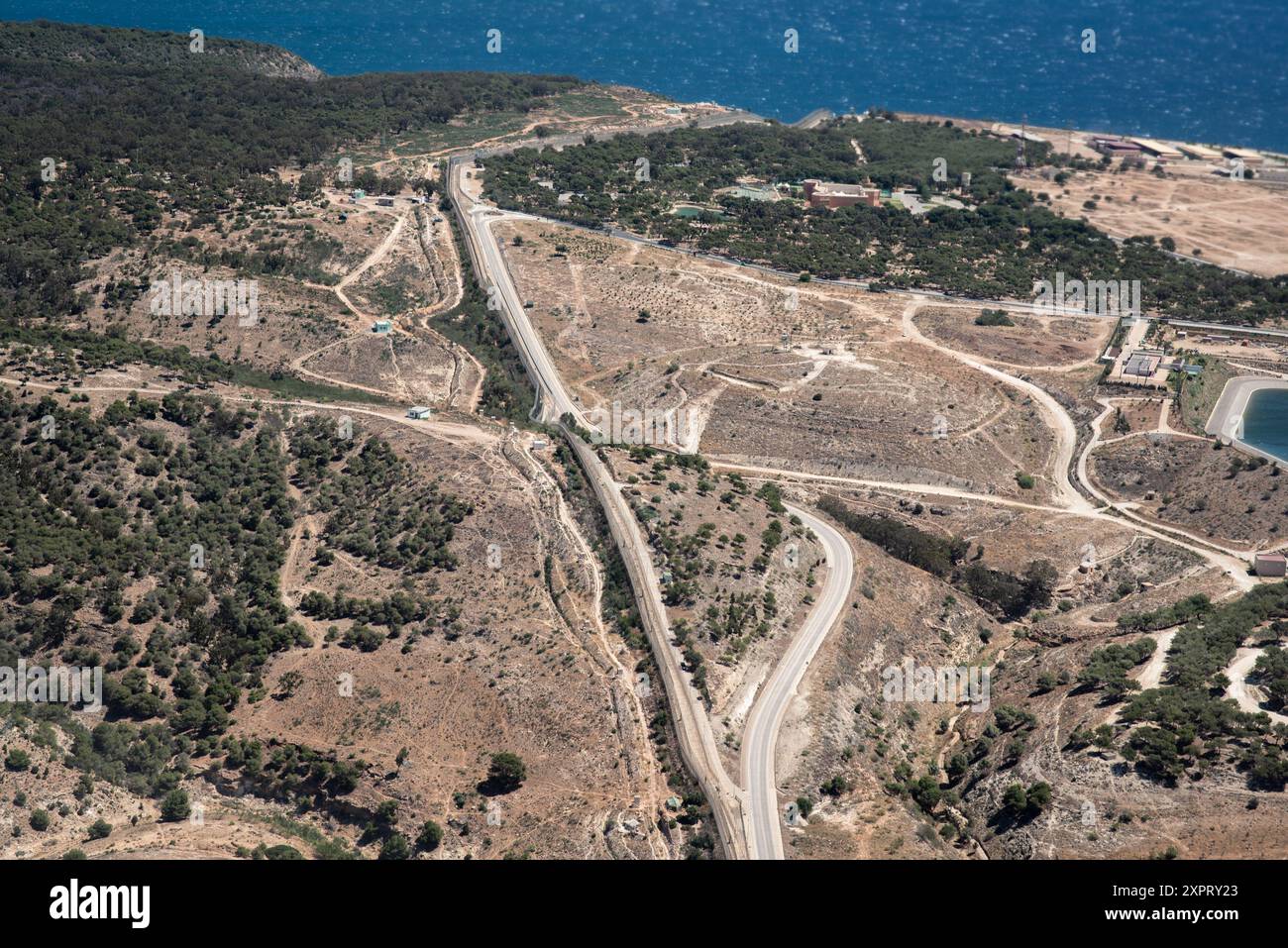 A high aerial photograph showing the expansive border fence at Melilla ...