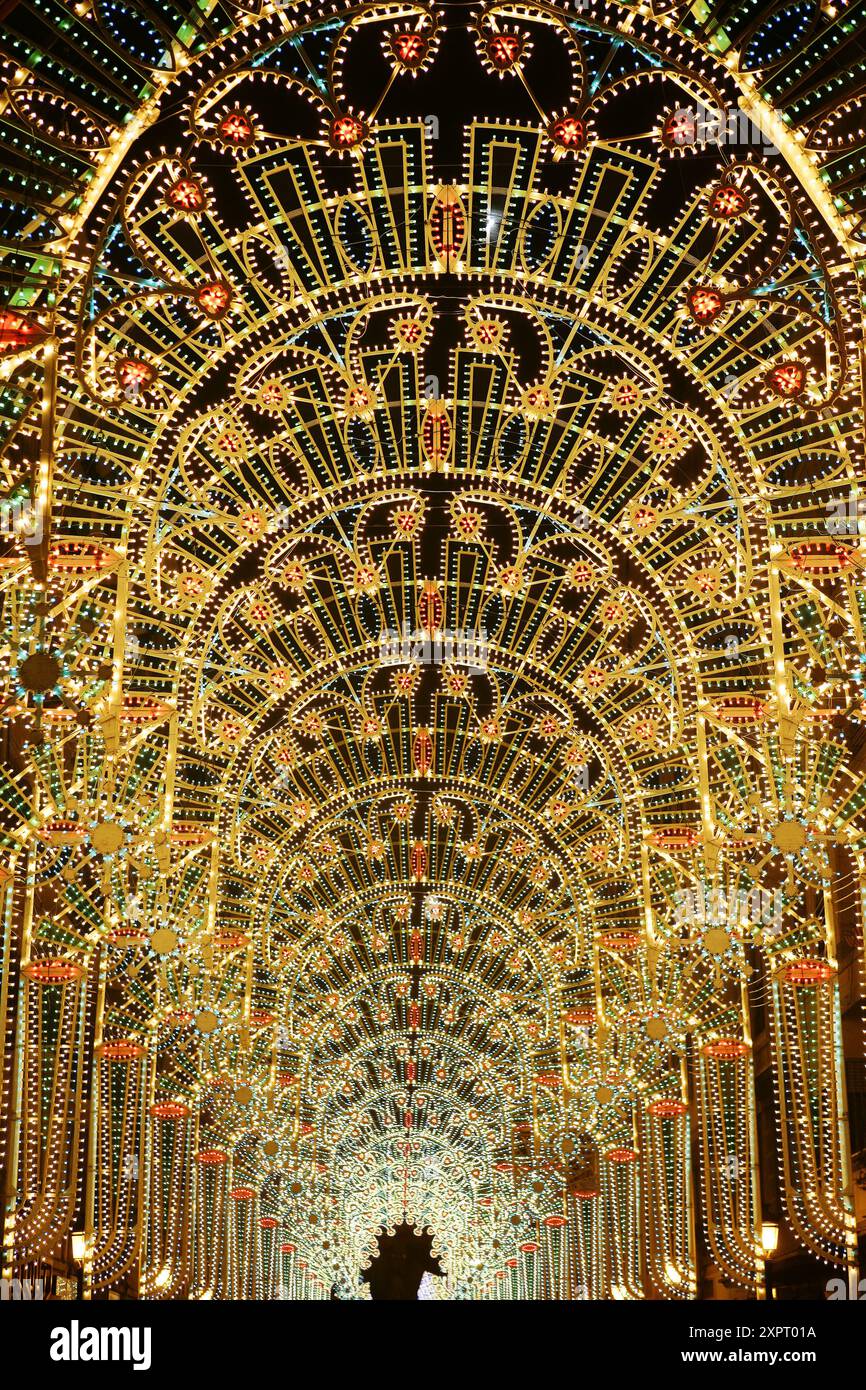 Light colorful decorated street in Valencia during 'Las Fallas'. Spain ...