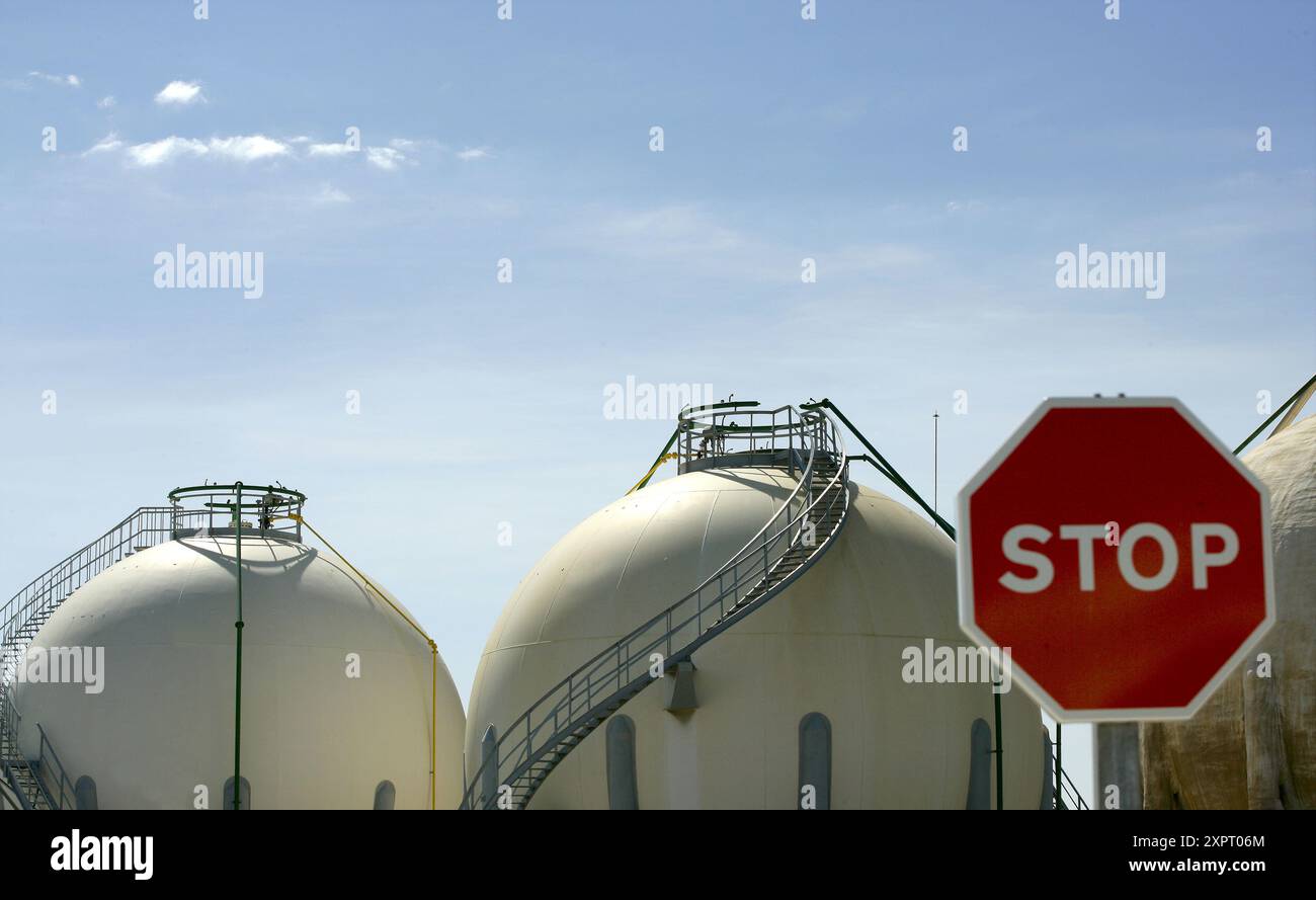 Gas refinery with stop traffic signal Stock Photo - Alamy