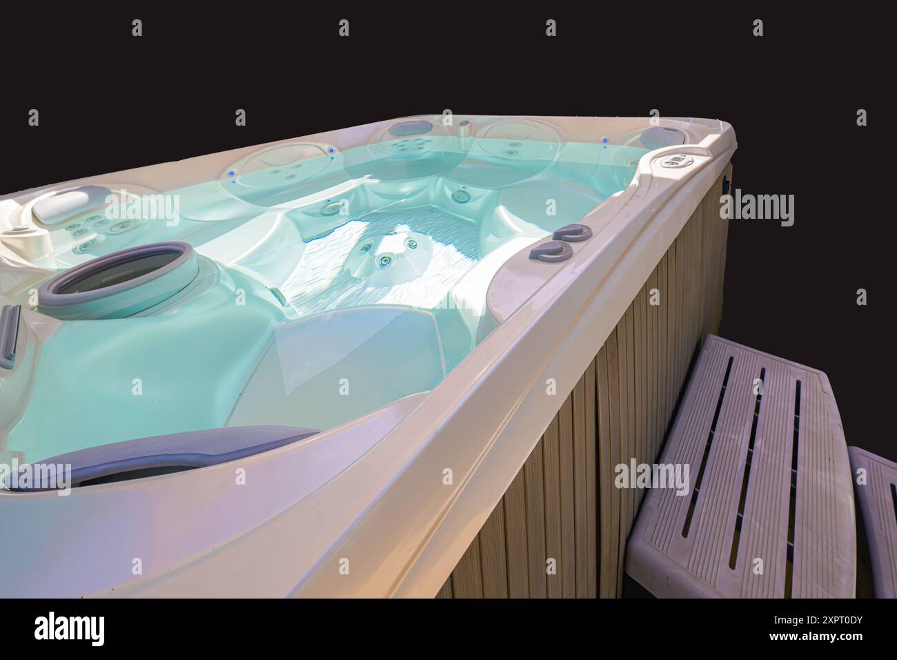 hot tub with crystal clear water, isolated on a sleek black background ...