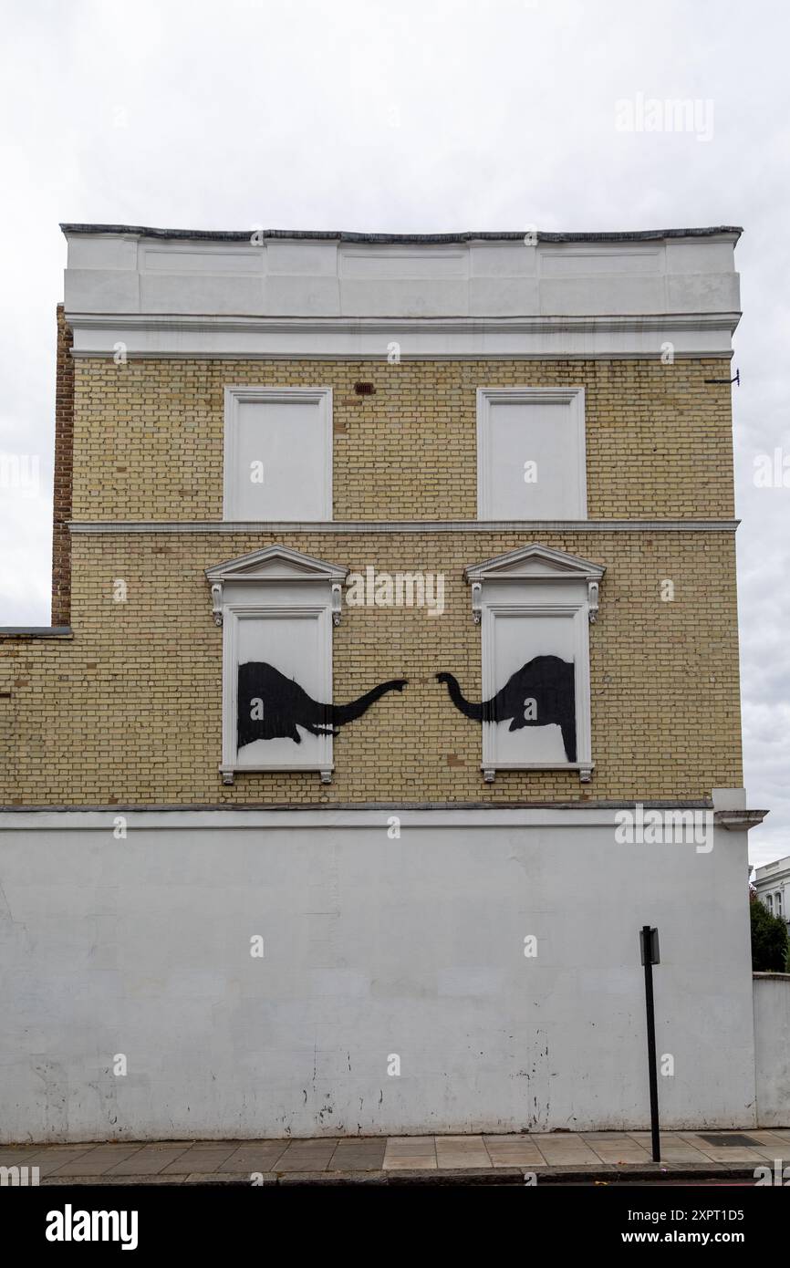 Two elephants as a mural by Banksy off Edith Street, Chelsea Stock ...