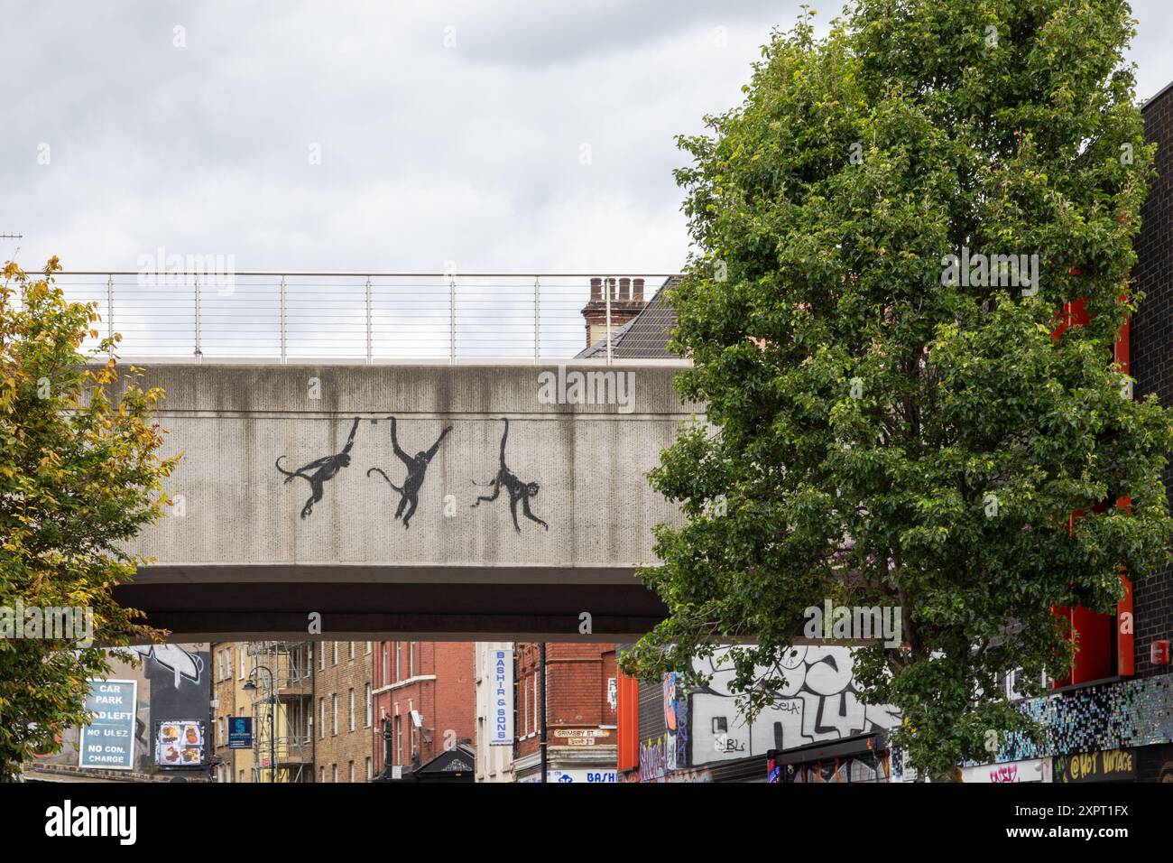 Banksy's three monkeys on the bridge at junction of Brick Lane East ...