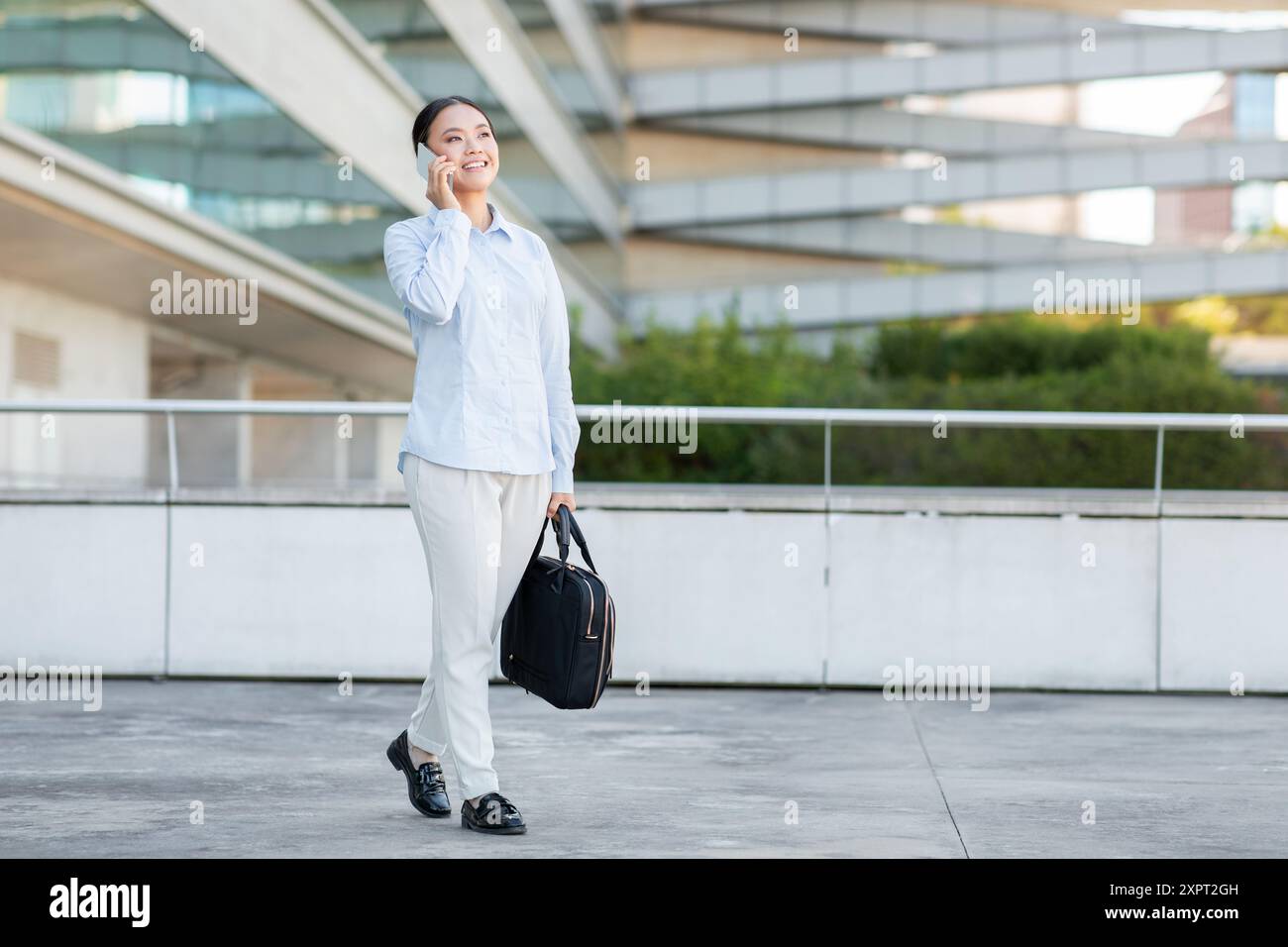 Business Professional Walking Outside While Talking on the Phone Stock ...