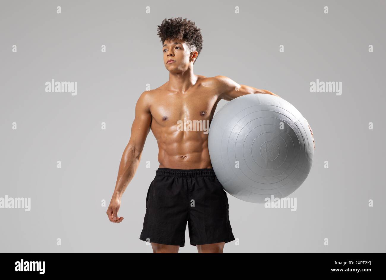 Fitness Enthusiast Poses Confidently With Stability Ball During Workout ...