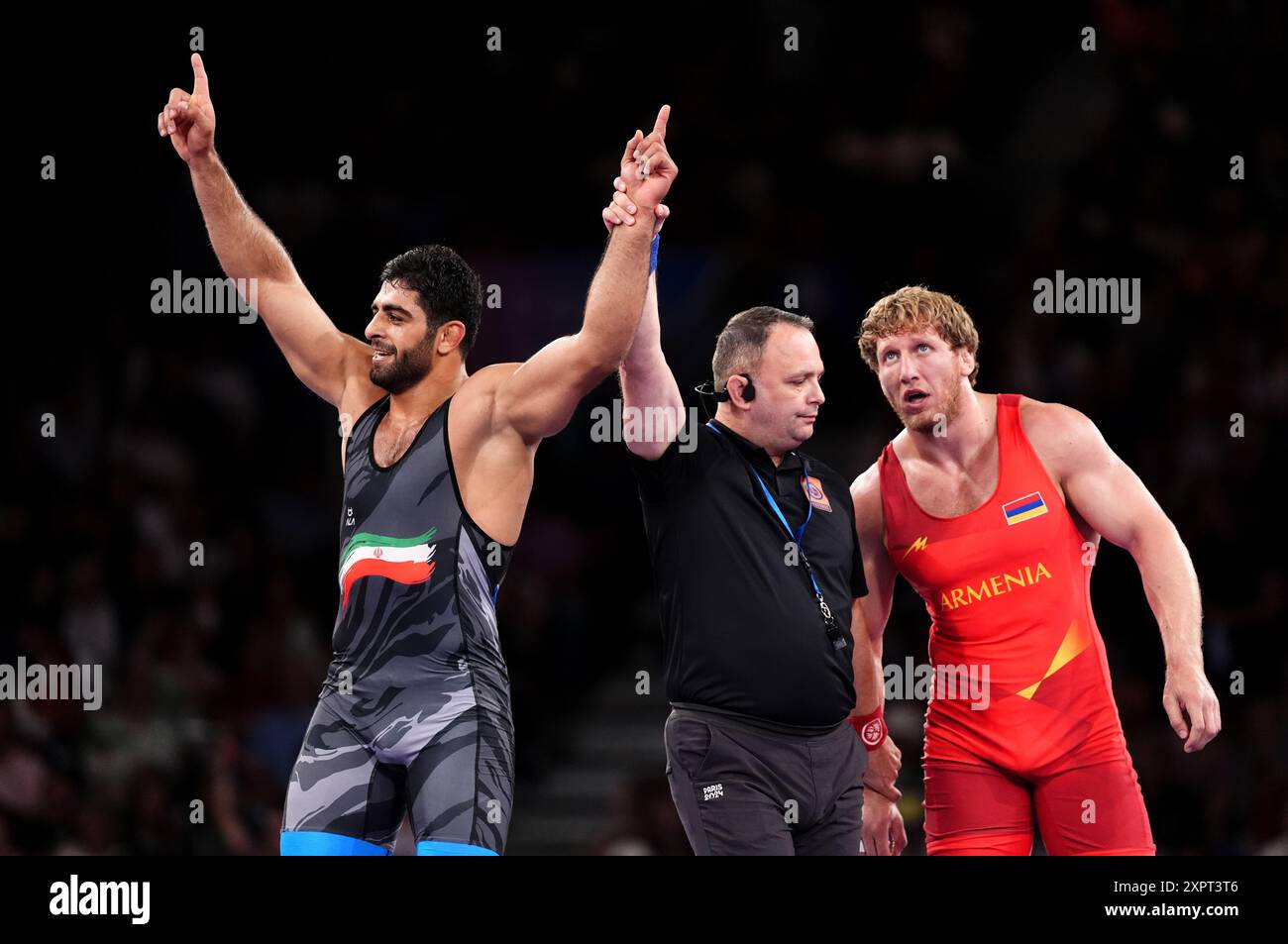 Iran's Mohammadhadi Saravi (left) celebrates following the Men's Greco ...