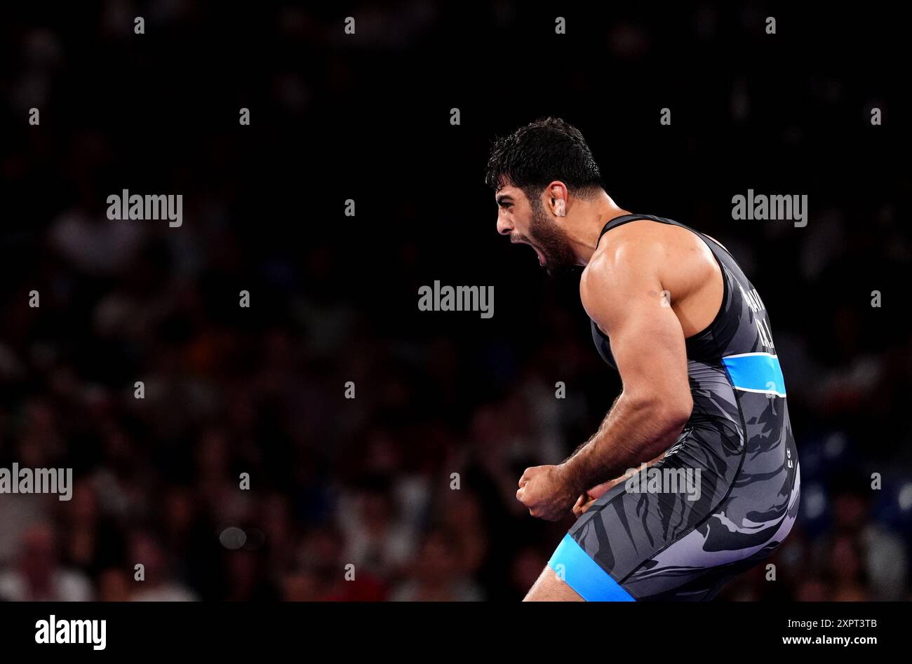 Iran's Mohammadhadi Saravi celebrates following the Men's Greco-Roman ...