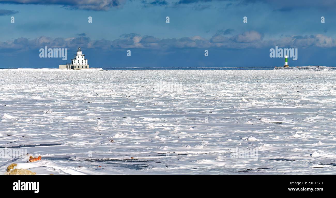 Lake Michigan Lighthouse and the frozen mouth of the Manitowoc River ...