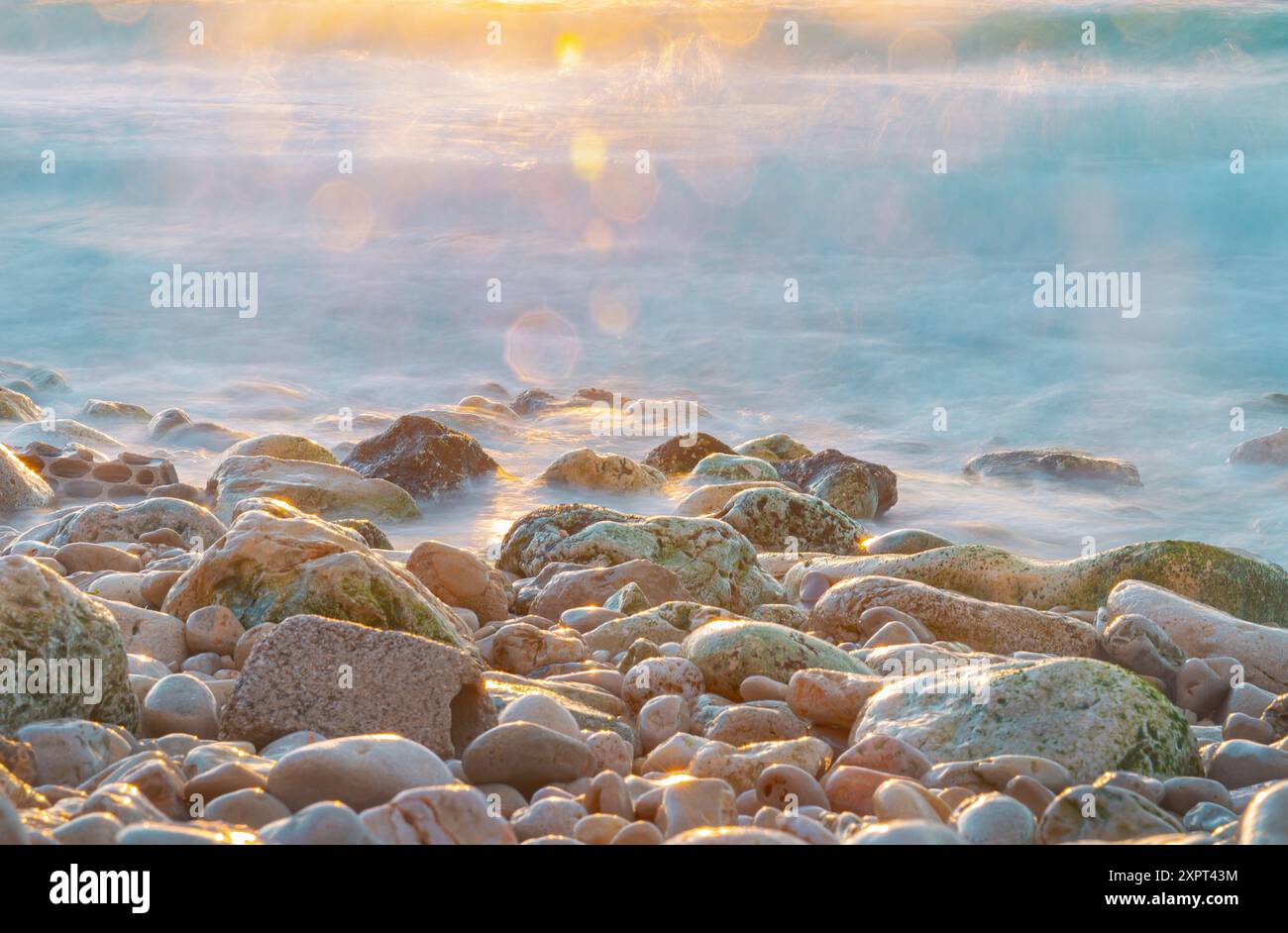 Sun bokeh glowing on the beach Stock Photo - Alamy
