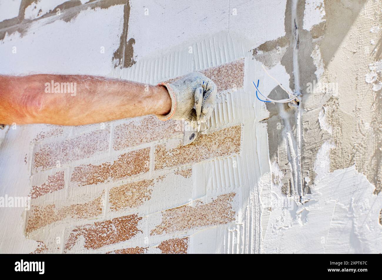 External cladding of facade house with thin faux brick panels ...