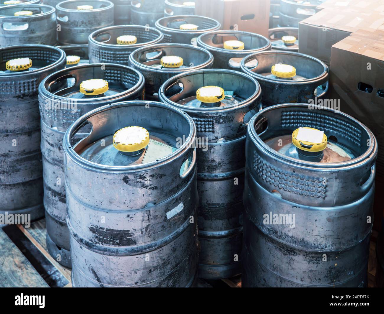 Stacked beer kegs at brewery yard, robust supply chain and storage of ...