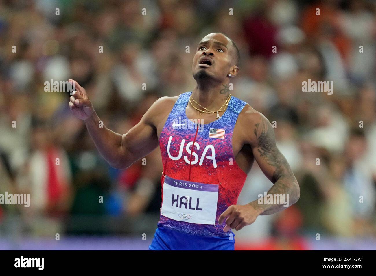 Quincy Hall, of the United States, looks up at the results after ...
