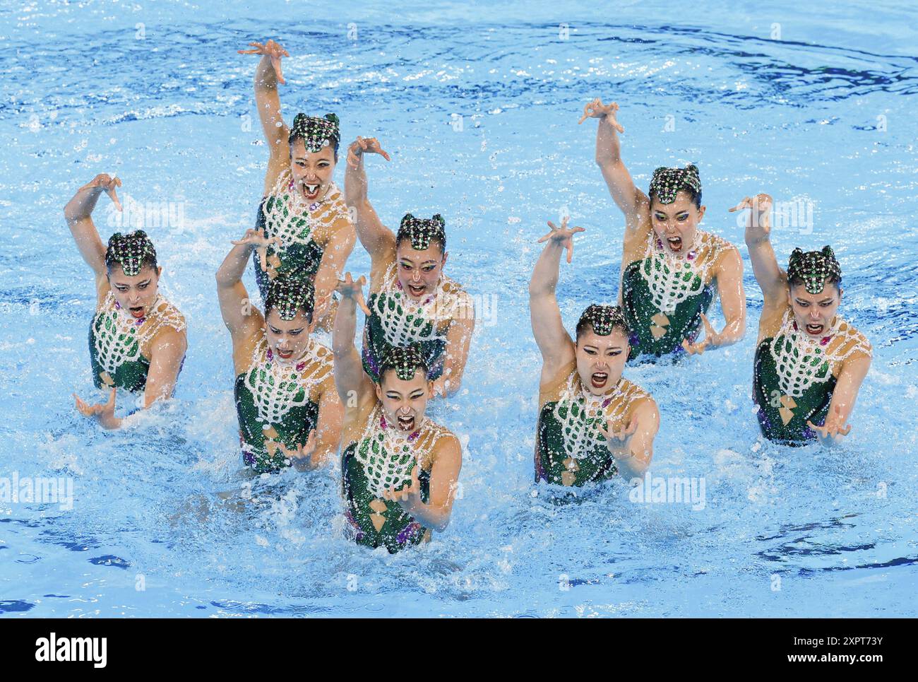 Japan artistic swimming team members perform in the team acrobatic ...