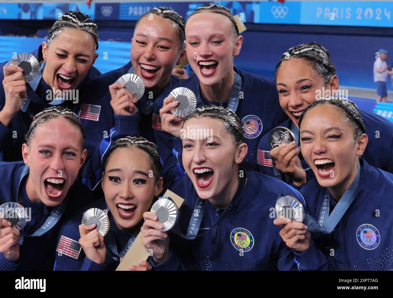 Members of the United States team pose for cameras with their silver ...