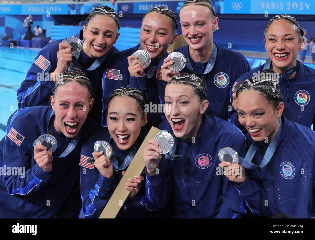 Members of the United States team pose for cameras with their silver ...