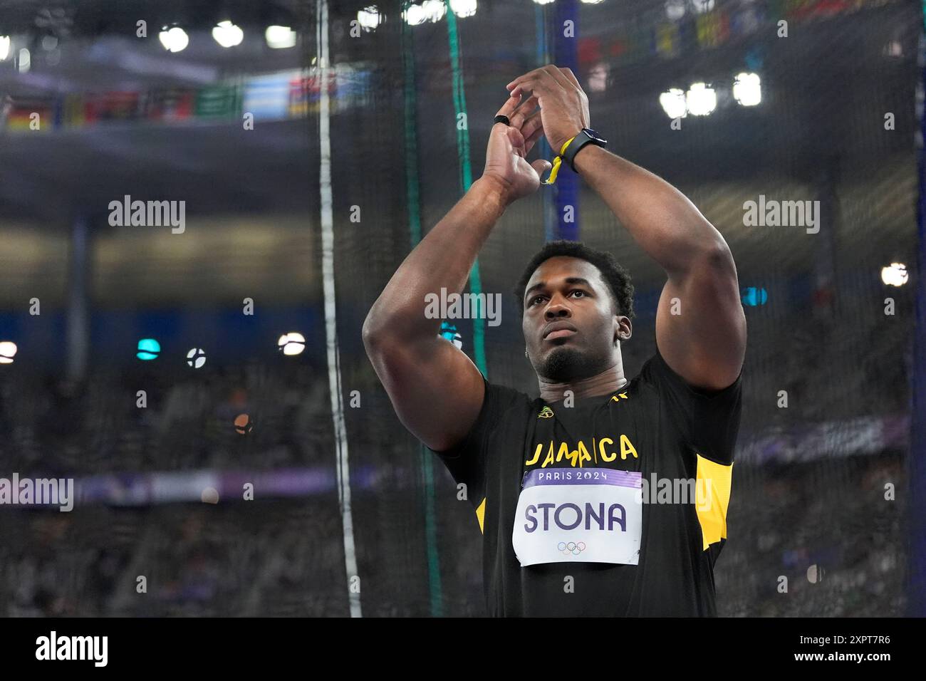 Roje Stona, of Jamaica, celebrates after winning the men's discus throw ...